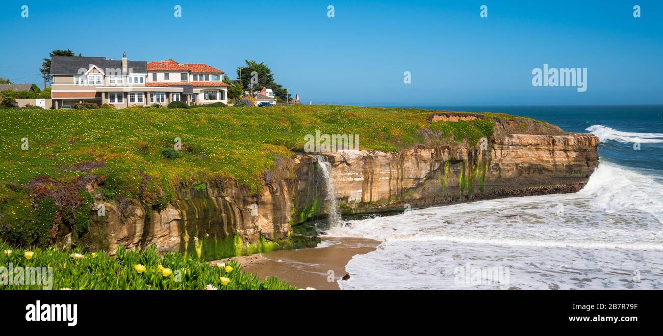 California coastline with a waterfall in spring with blue sky Stock ...
