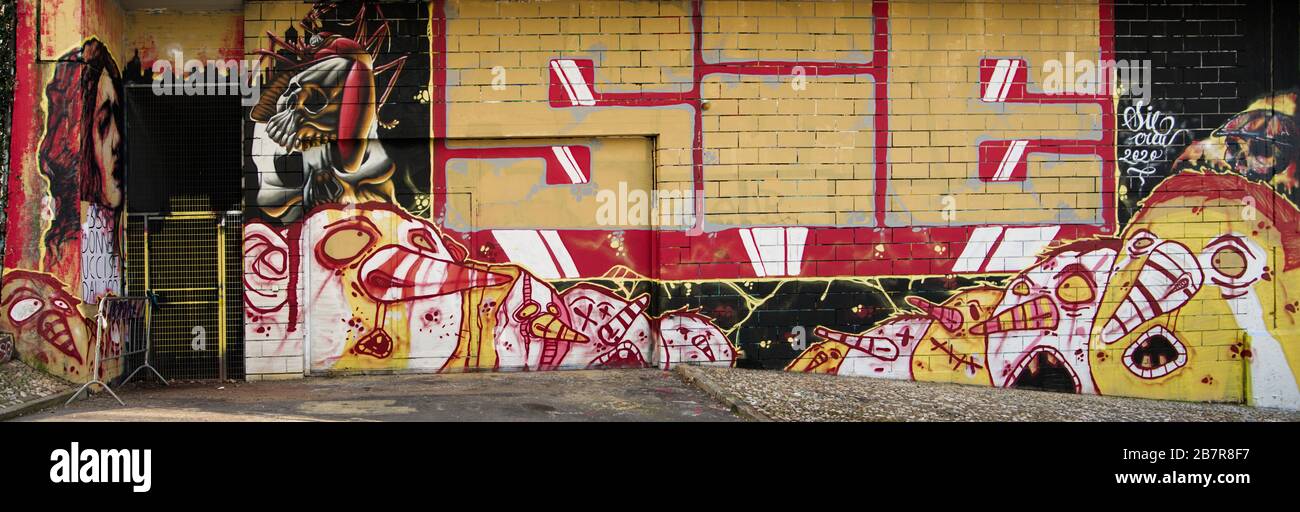 Modern graffiti in Porta Garibaldi distrect of Milan, Italy, depicting ...