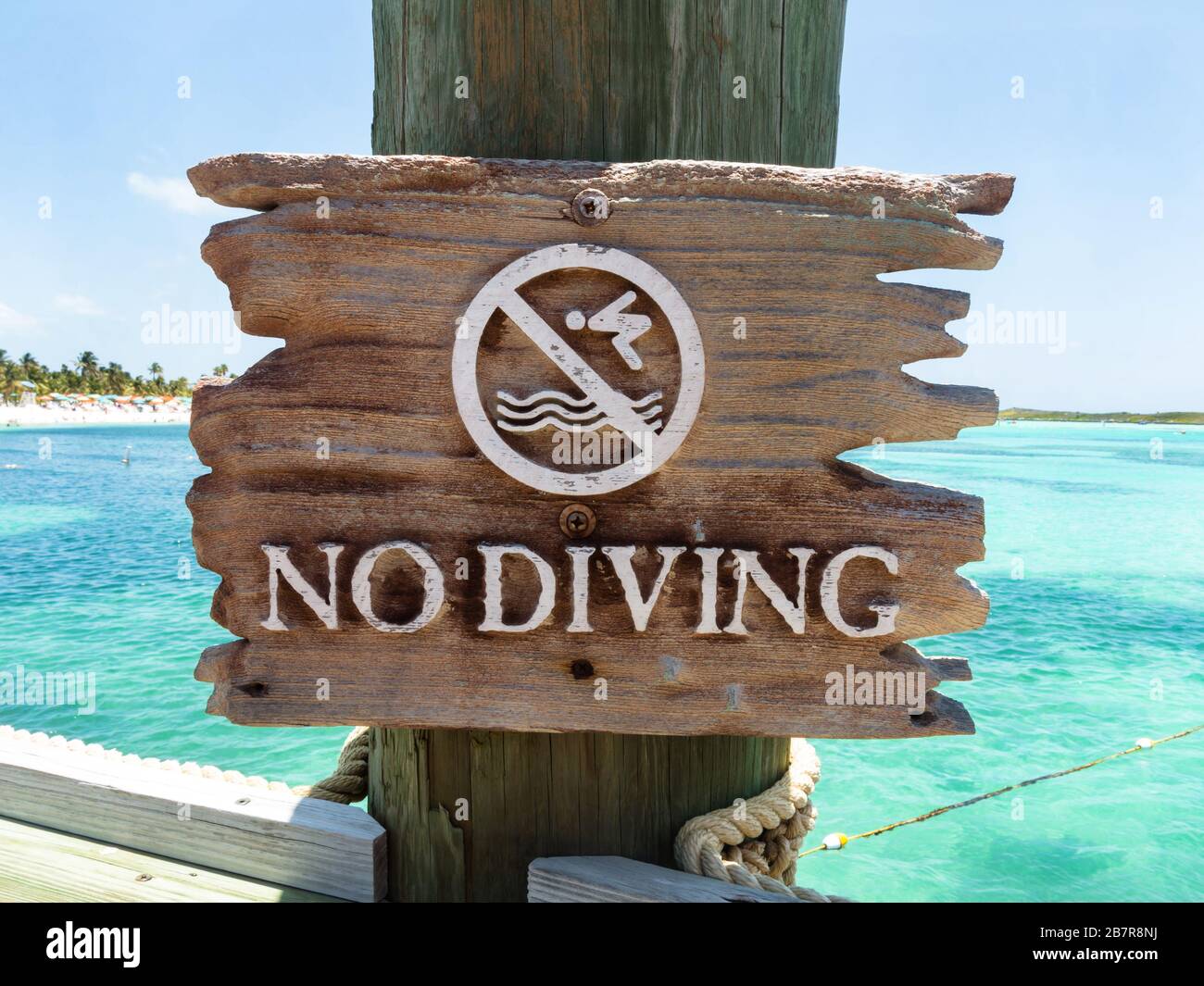 A sign that reads no diving with the ocean behind Stock Photo - Alamy