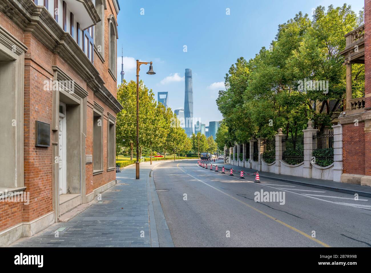 Shanghai street view with LujiaZui landmark buildings at distance ...