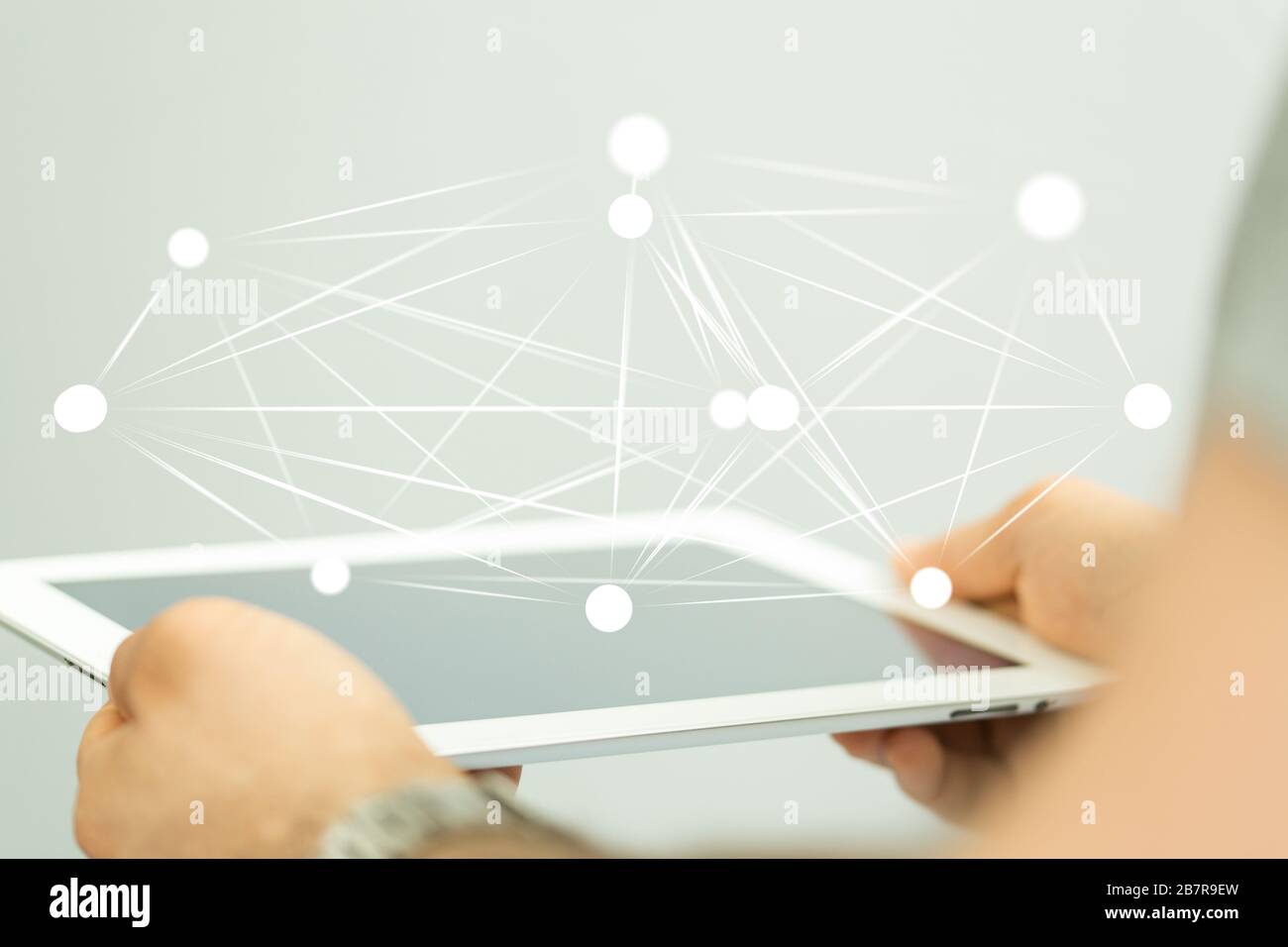 Closeup shot of a person presenting the virtual projection of a digital ...