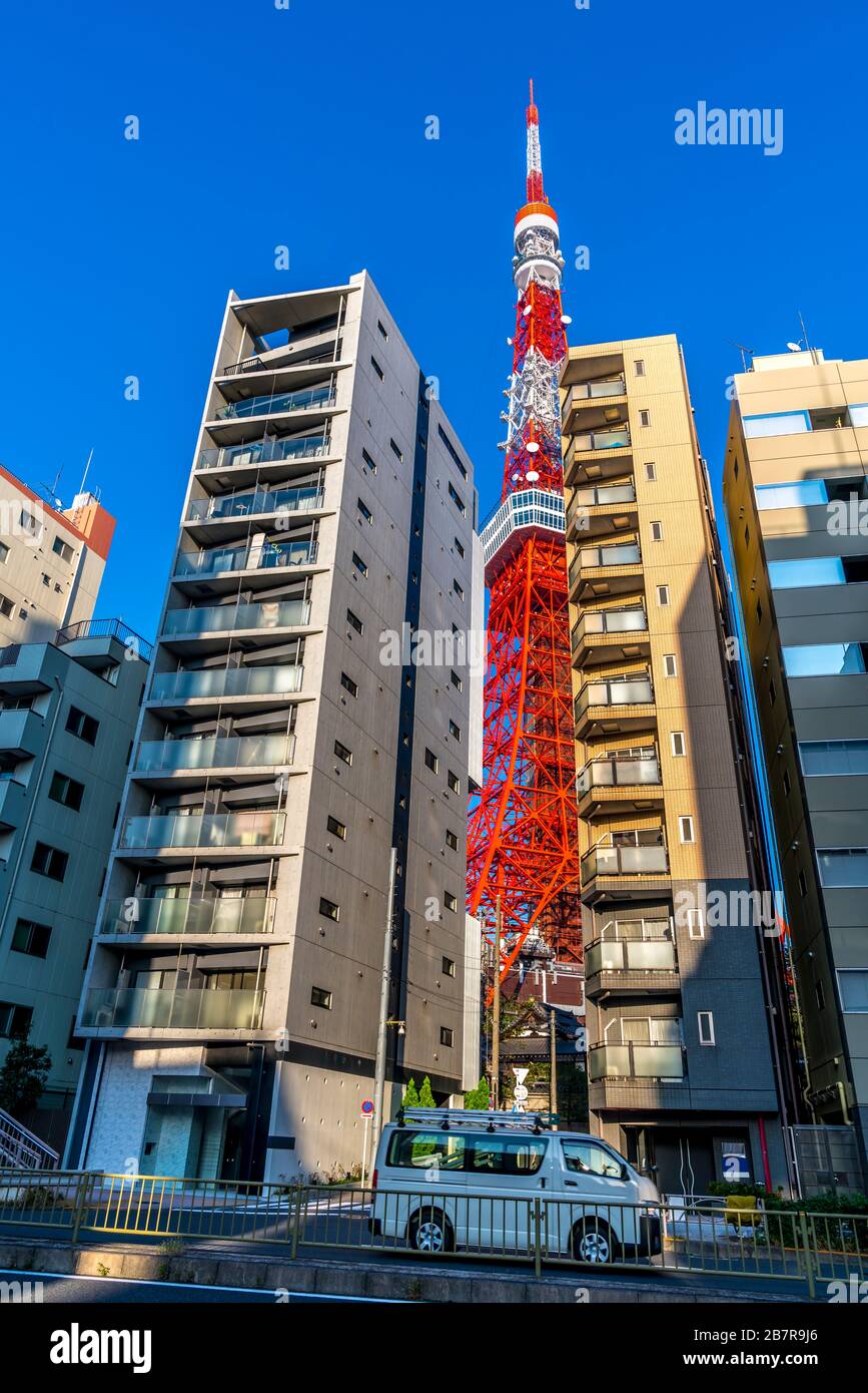Tokyo tower between crowed tall buildings, Japan Stock Photo - Alamy