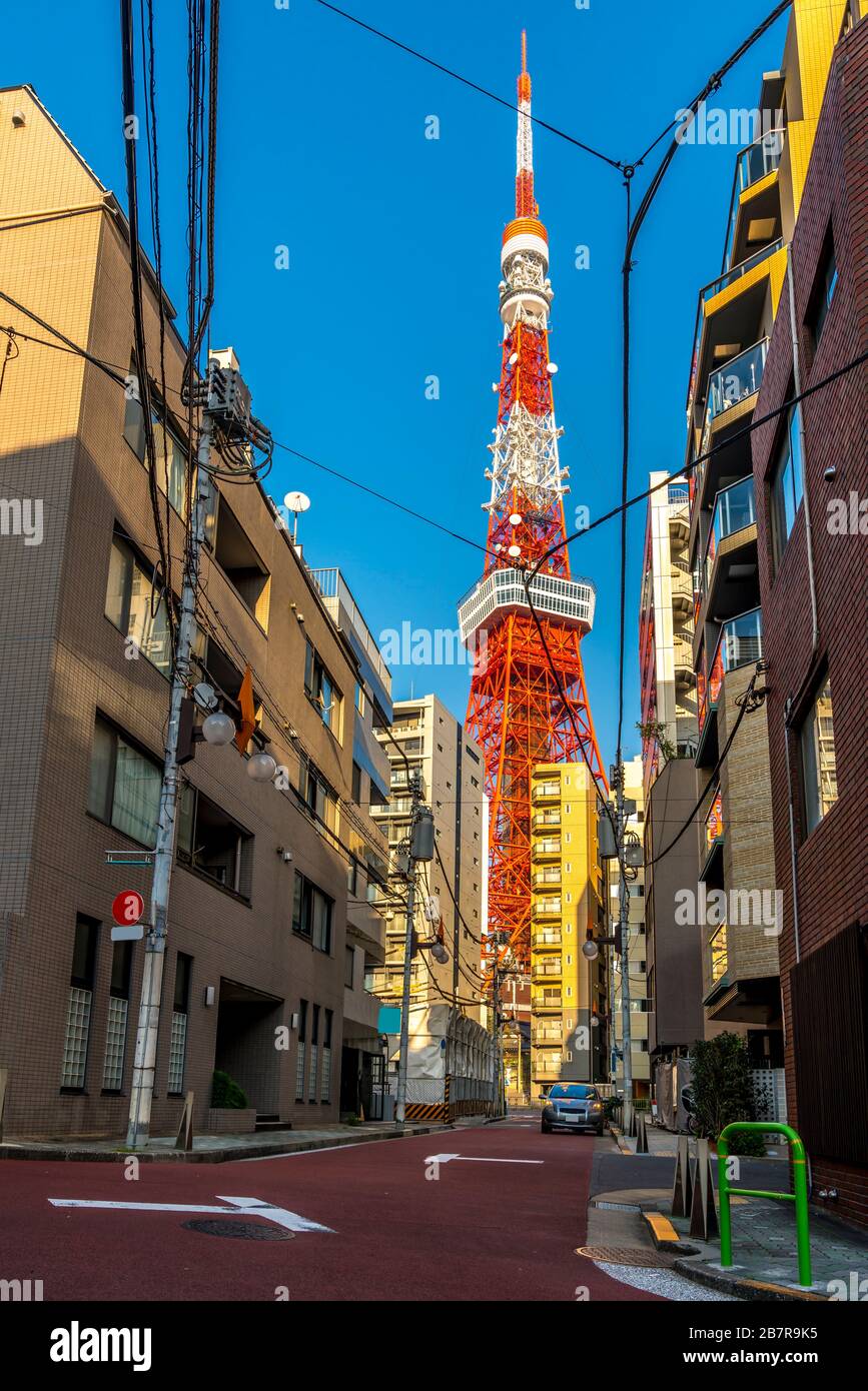 Street view in Tokyo with Tokyo tower at distance, Japan Stock Photo ...