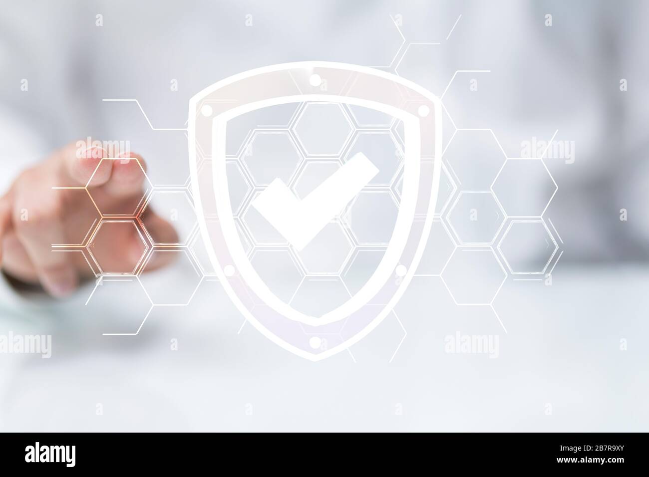 Businessman presenting a virtual projection of an emblem with a ...