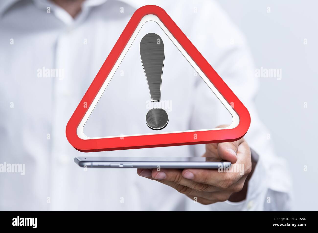 Person presenting the virtual projection of a warning sign Stock Photo ...