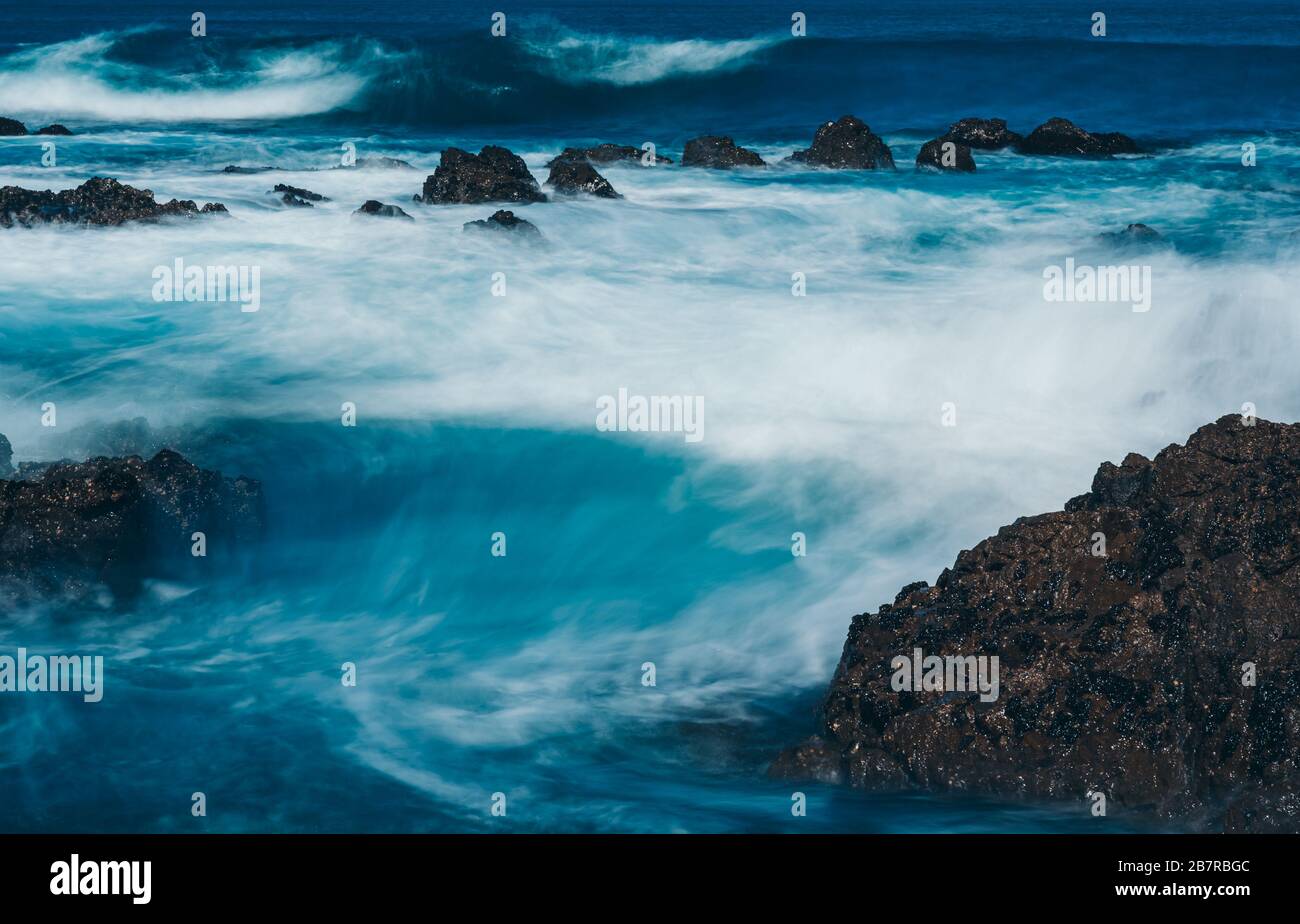Long Exposure Of Sea Wave with rock Stock Photo - Alamy