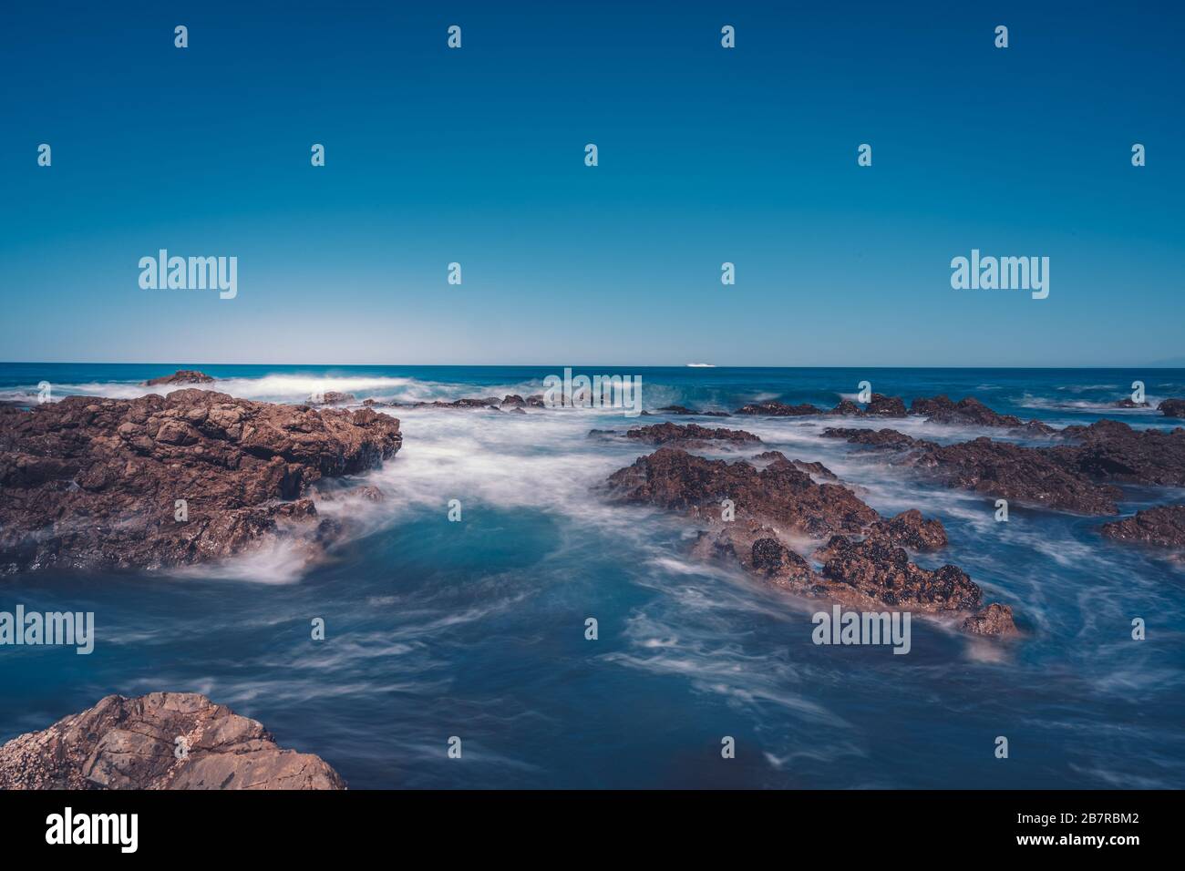 Long Exposure Of Sea Wave with rock Stock Photo - Alamy