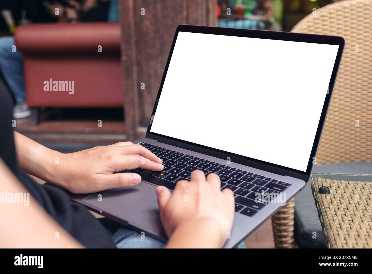 Mockup image of hands using and typing on laptop with blank white ...