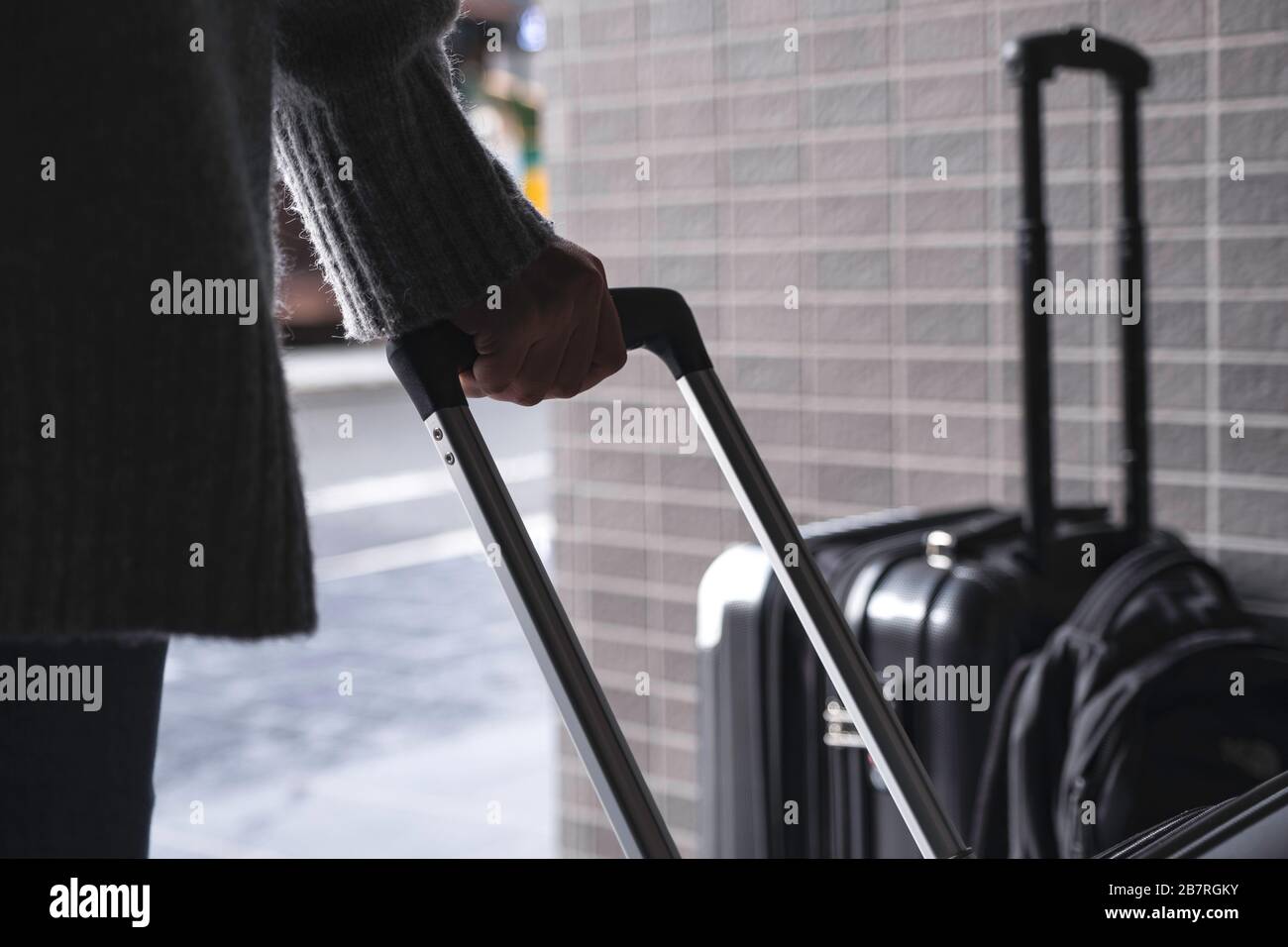 Dragging a suitcase hi-res stock photography and images - Alamy