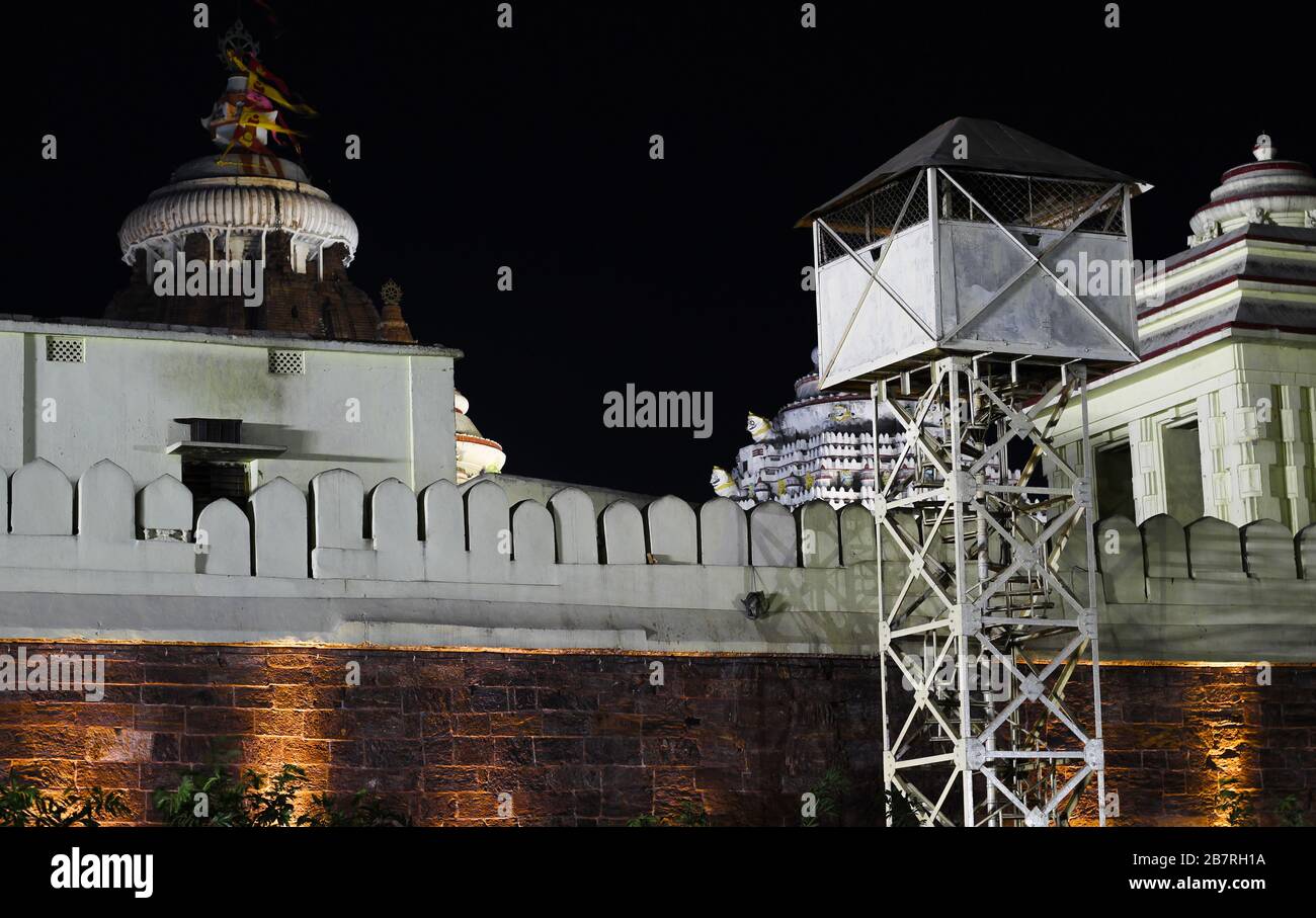 Sri jagannath temple boundry wall at night with colorful yellow lights ...
