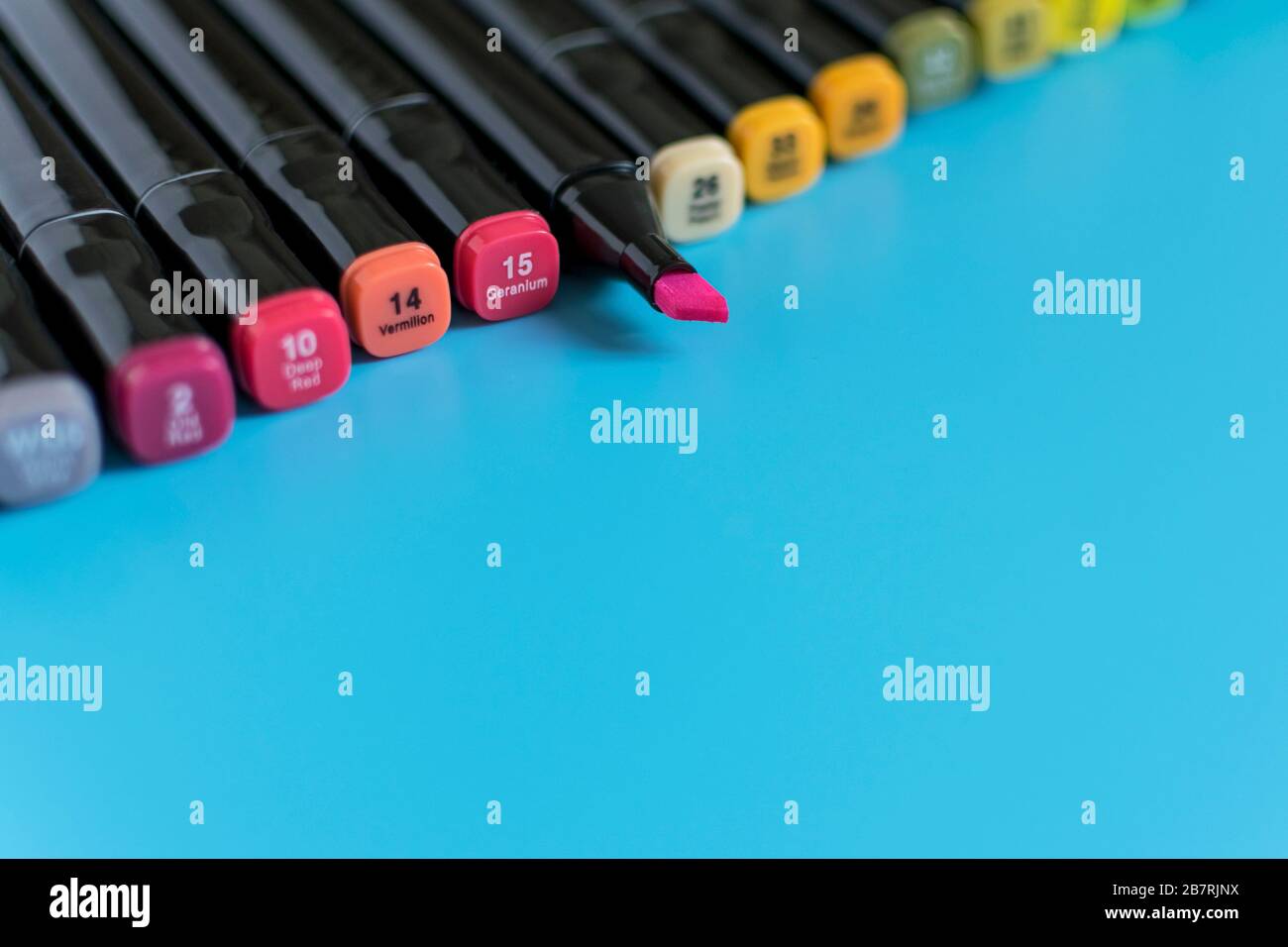 Multi-colored markers on a blue background. Marker for drawing and ...