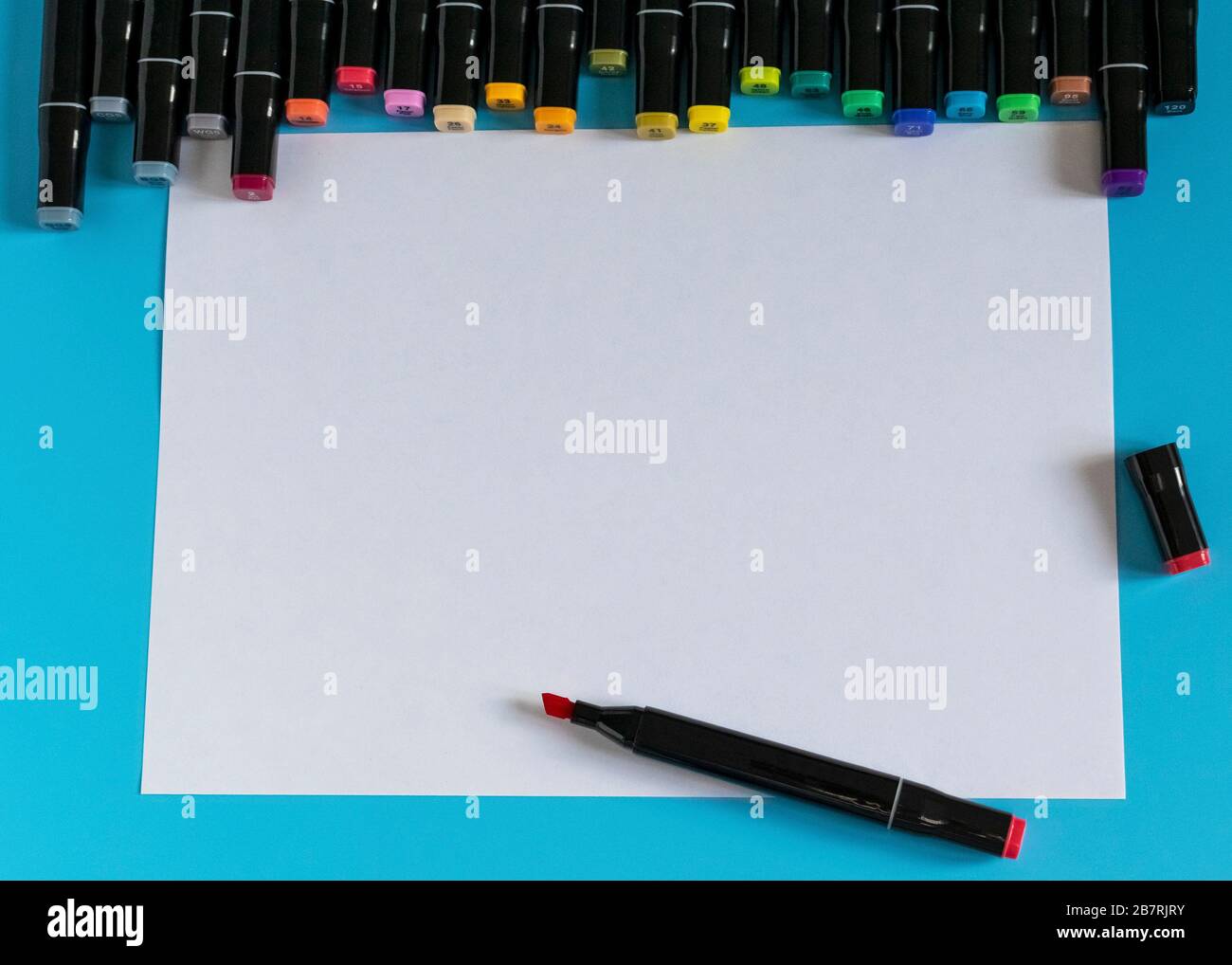 Multi-colored markers on a blue background. Marker for drawing and ...