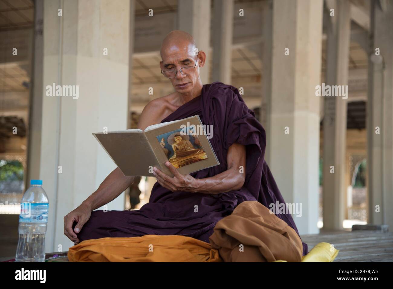 Myanmar: Bagan- Monk engaged in reciting the holy text in the vicinity ...