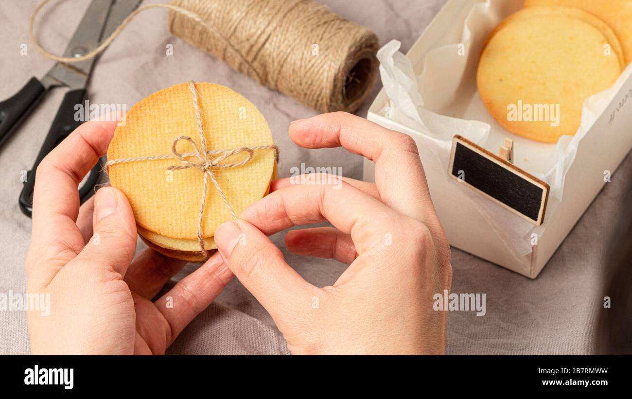 Stack of homemade cookies twisted with a rope Stock Photo - Alamy