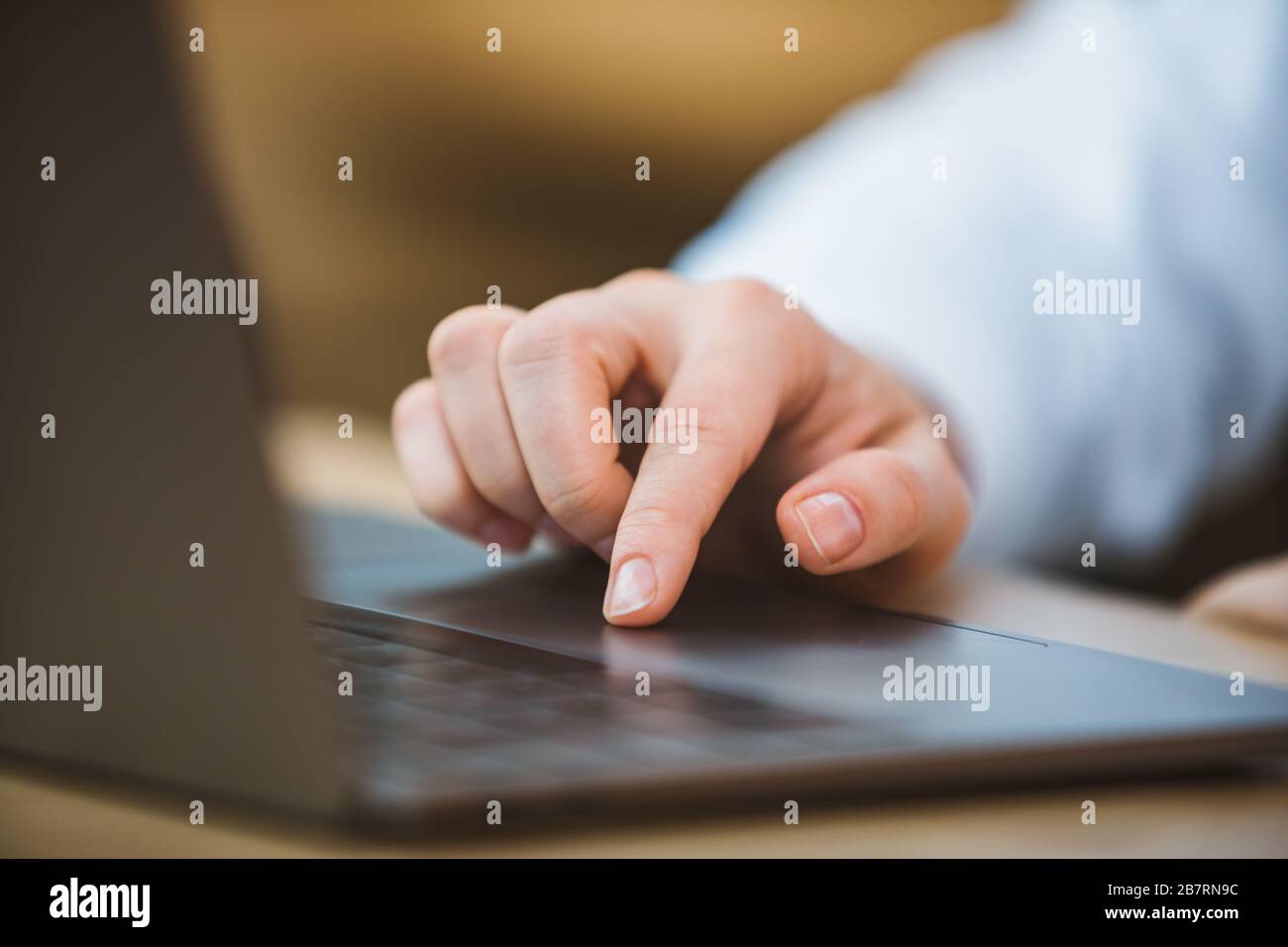 woman hand on laptop touchpad close up Stock Photo - Alamy