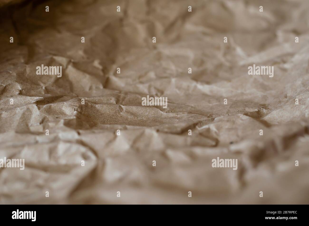 The texture of crumpled paper. Brown paper in a receding perspective ...