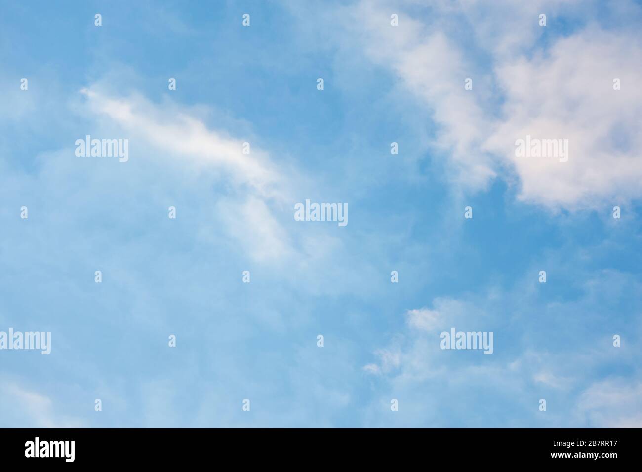 texture bright contrast sky with clouds and sun rays Stock Photo - Alamy
