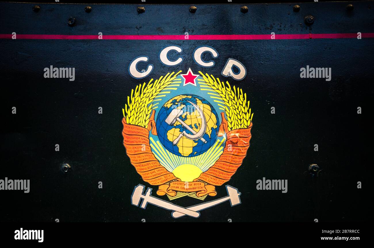 Old retro former Soviet Union coat of arms on wall of train locomotive ...