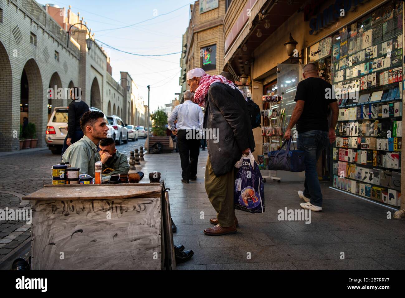 Iraq, Iraqi Kurdistan, Arbil, Erbil. A old man with a red and white ...