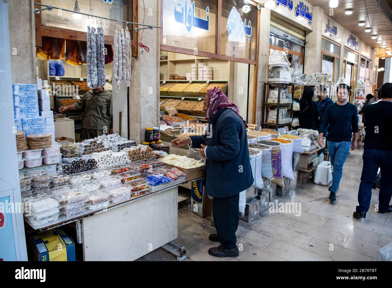 Iraq, Iraqi Kurdistan, Arbil, Erbil. In the bazaar, an old man with a ...
