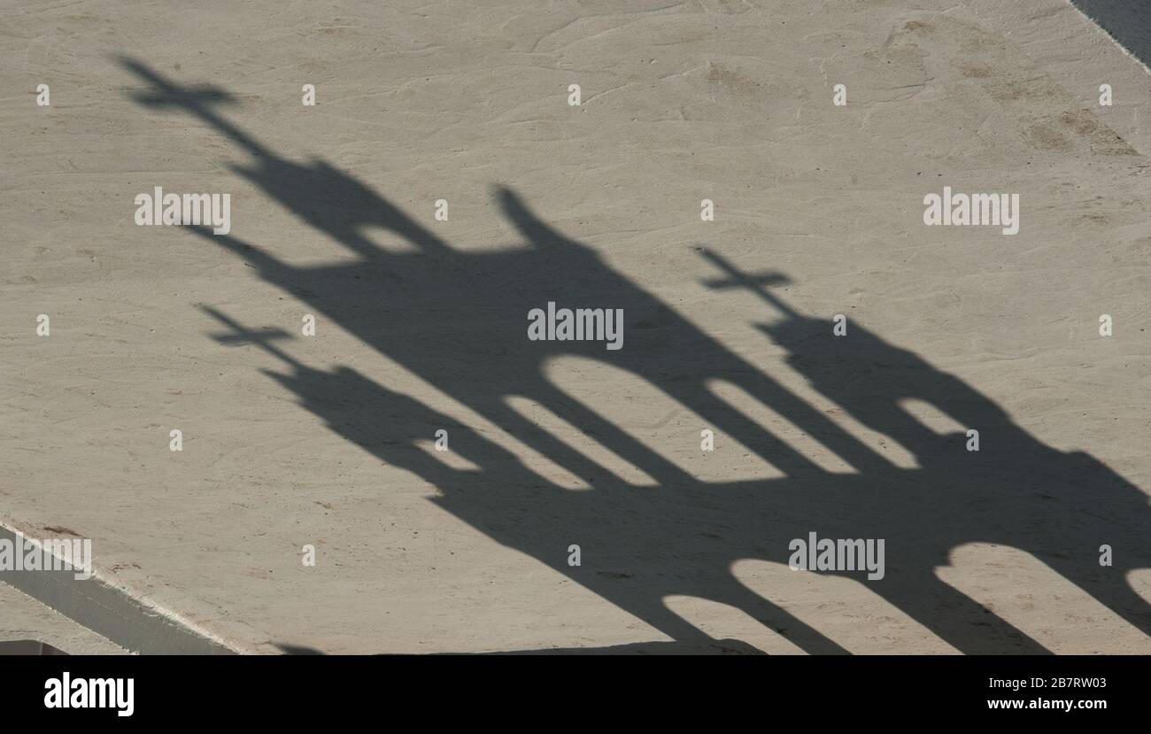 Shadow on ground of greek church tower in Santorini Greece at dusk ...