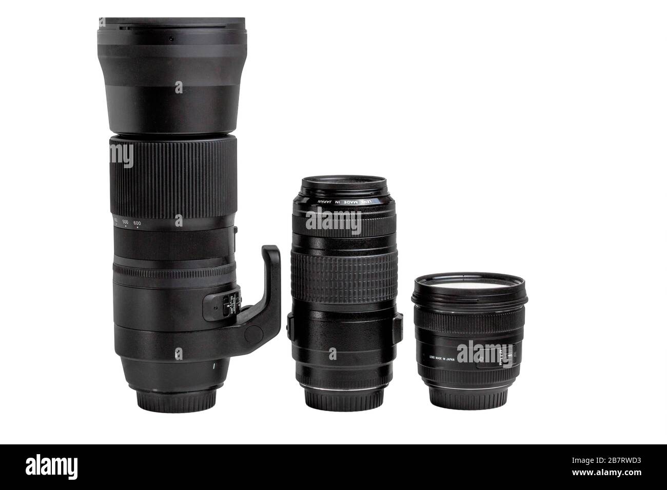image of three auto focus lenses for the camera on a white background ...