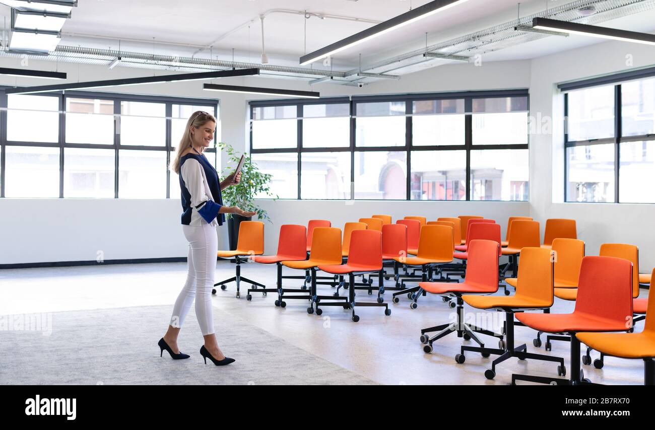 Woman standing in a chair hi-res stock photography and images - Alamy