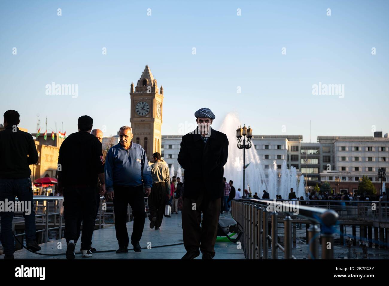 Iraq, Iraqi Kurdistan, Arbil, Erbil. On the park Shar, men are walking ...