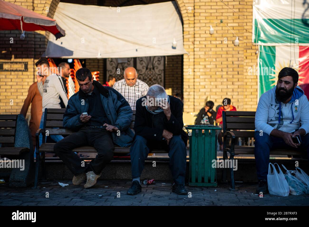 Iraq, Iraqi Kurdistan, Arbil, Erbil. On the park shar, three men are ...