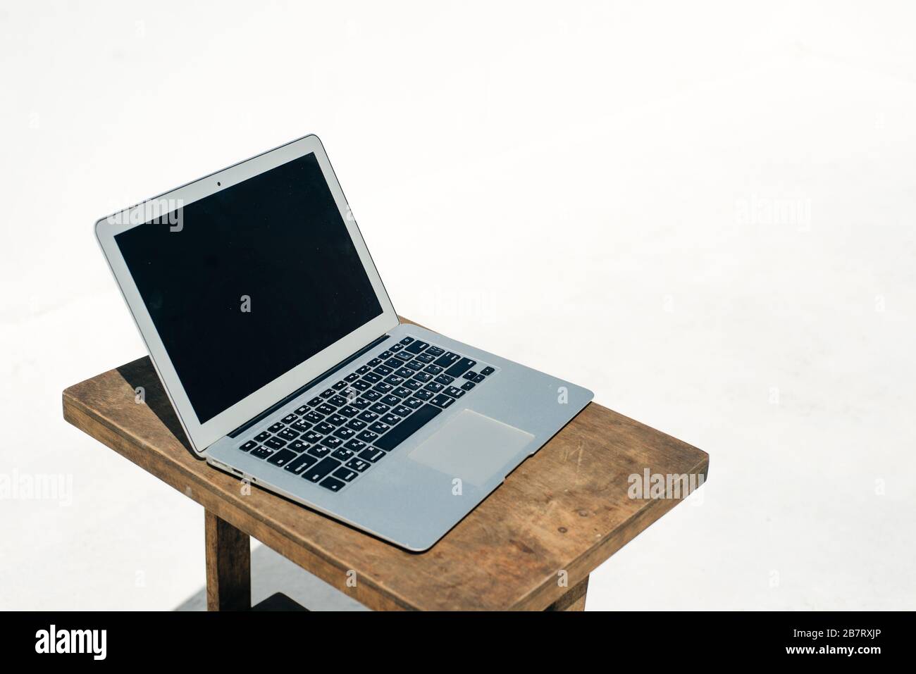 Modern metal laptop on a white background Stock Photo - Alamy
