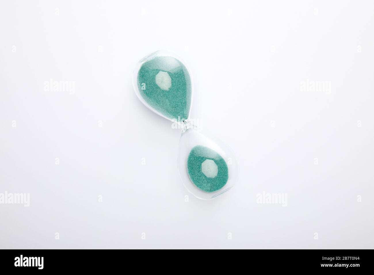 top view of hourglass on white background Stock Photo - Alamy