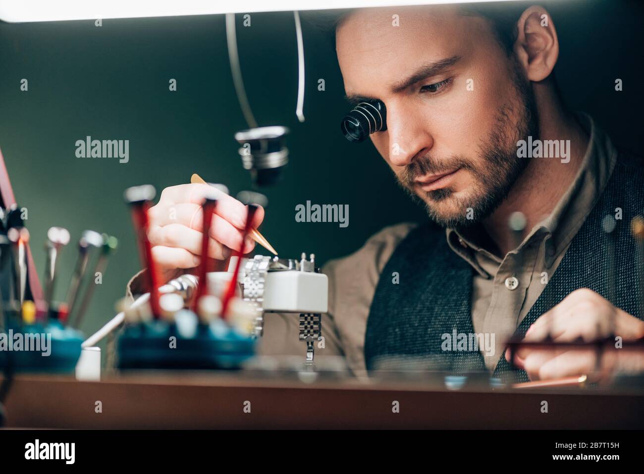 Person repairing clock hi-res stock photography and images - Alamy