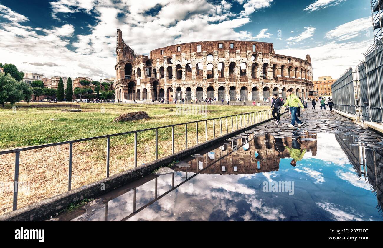 Water reflections of Colosseum with blue sky, Rome Stock Photo - Alamy