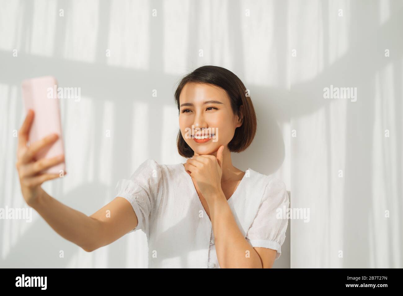 Young woman taking via hi-res stock photography and images - Alamy