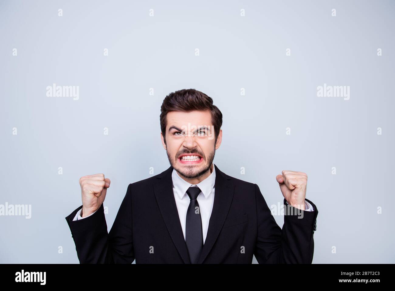 Angry man showing teeth hi-res stock photography and images - Alamy