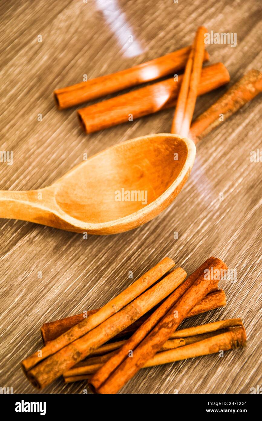 cinnamon sticks on the table with wooden spoon, beautiful christmas ...