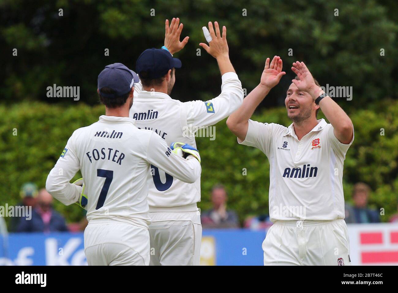 Graham Napier of Essex (R) celebrates taking the wicket of Rob Key ...