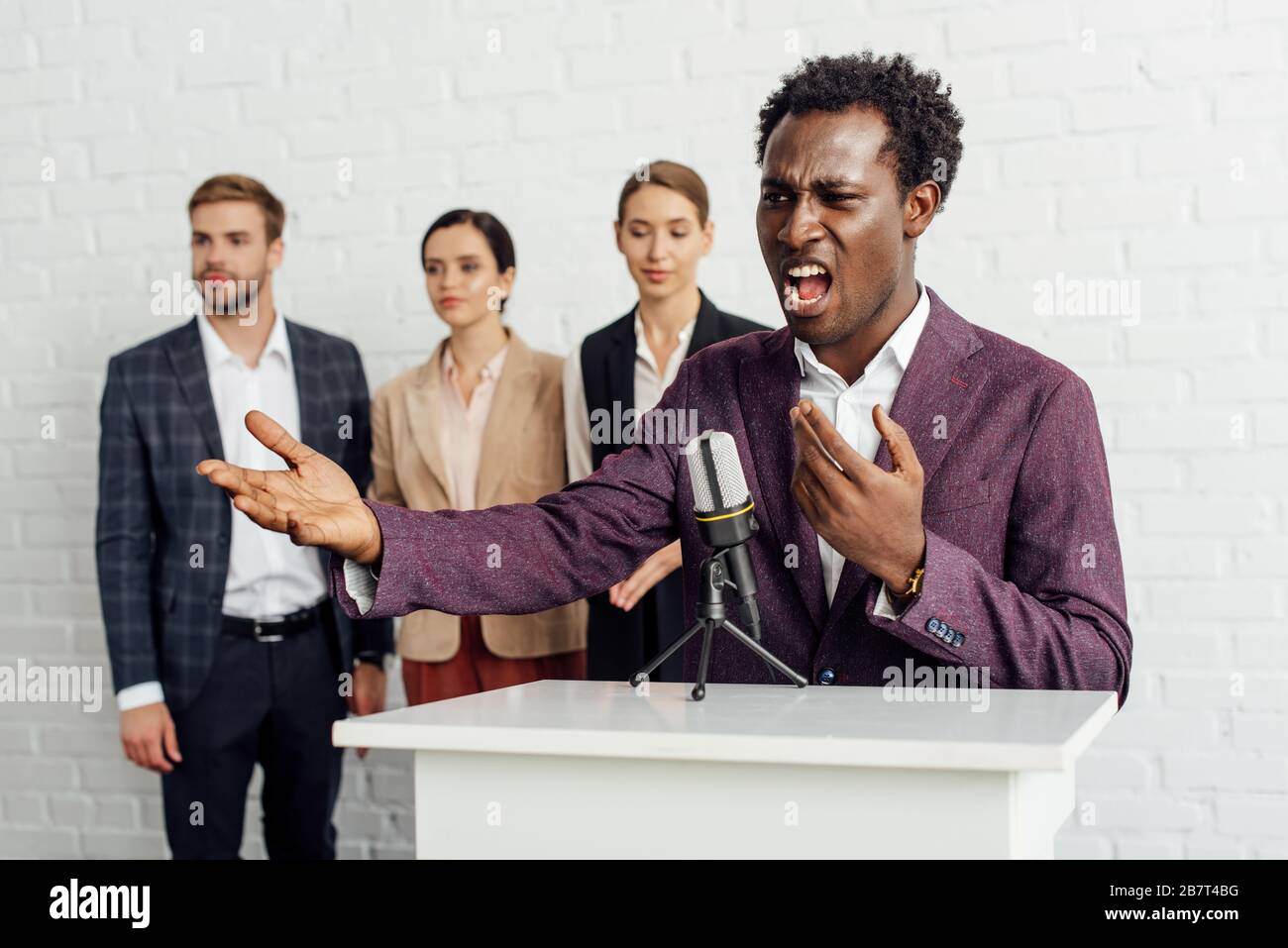African american man speaking at podium hi-res stock photography and ...