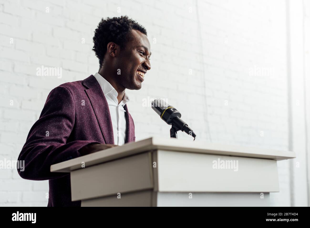 African american man speaking at podium hi-res stock photography and ...