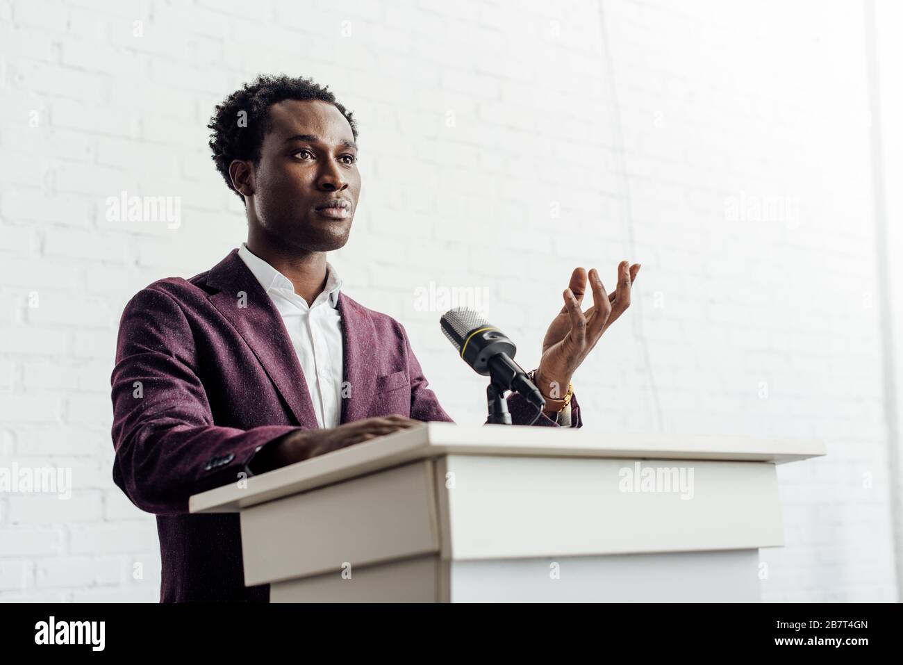 African american man speaking at podium hi-res stock photography and ...
