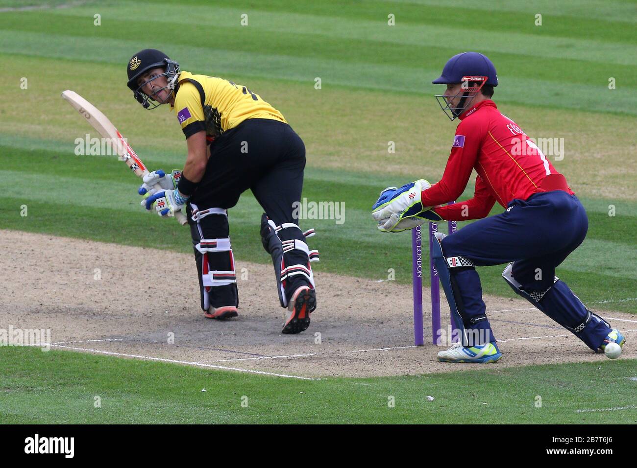 Callum Jackson in batting action for Sussex as James Foster looks on ...