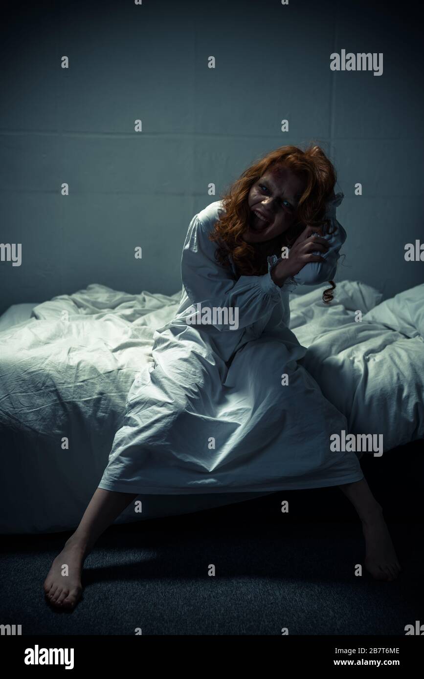 female demon in nightgown shouting in bedroom Stock Photo - Alamy