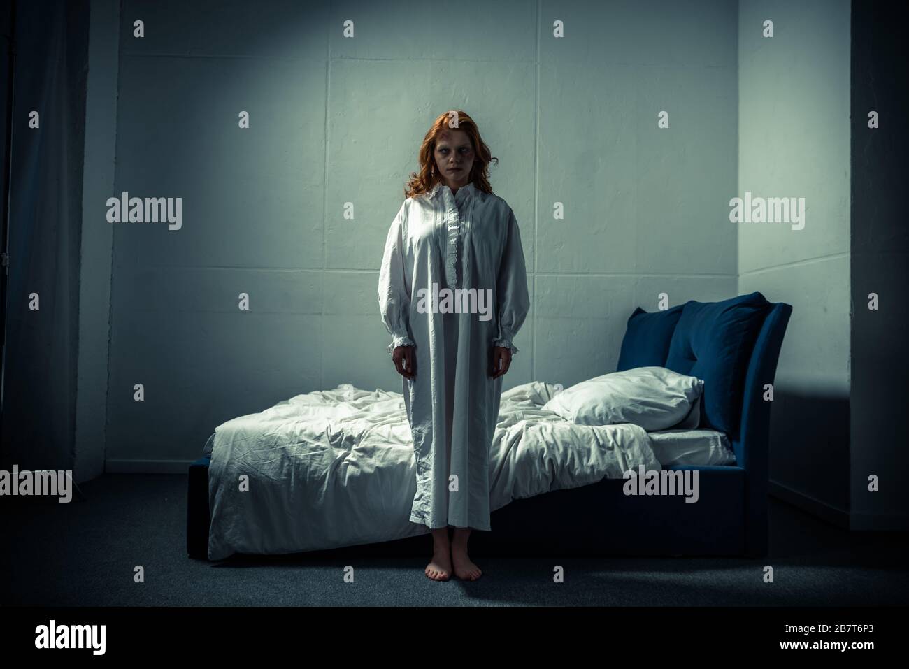 creepy female demon in nightgown standing in bedroom Stock Photo - Alamy
