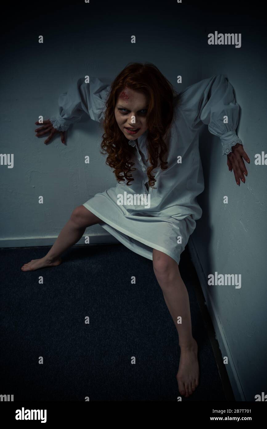 obsessed girl in nightgown screaming near wall Stock Photo - Alamy