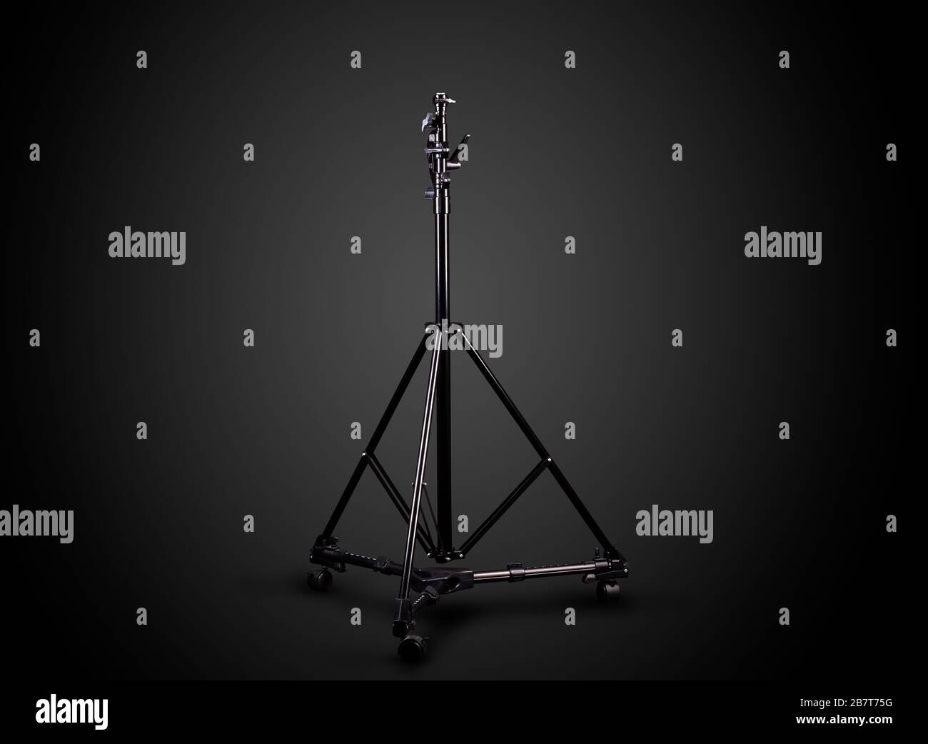 Photo studio lighting stands isolated on the black background Stock ...