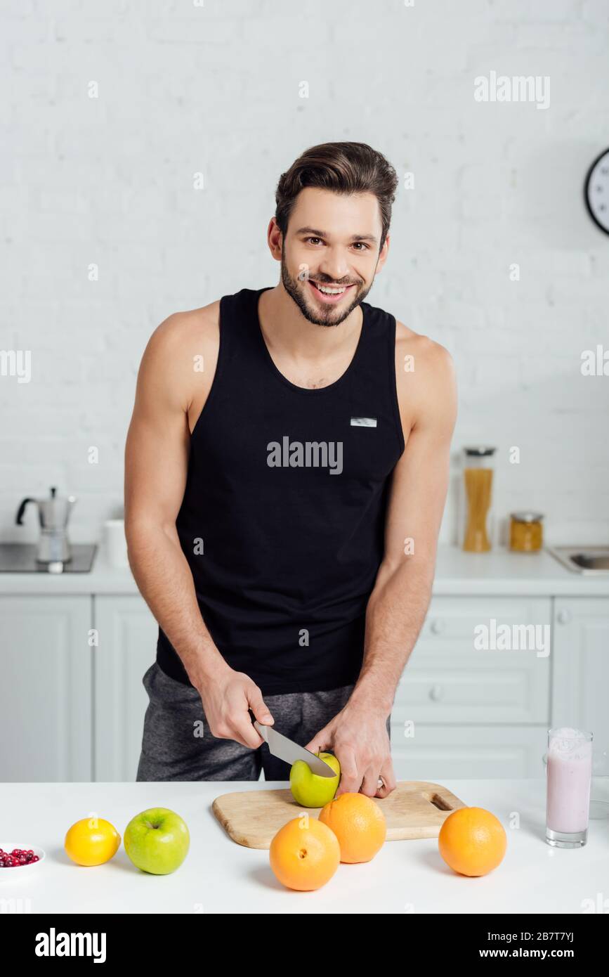 Happy sporty man eating apple hi-res stock photography and images - Alamy