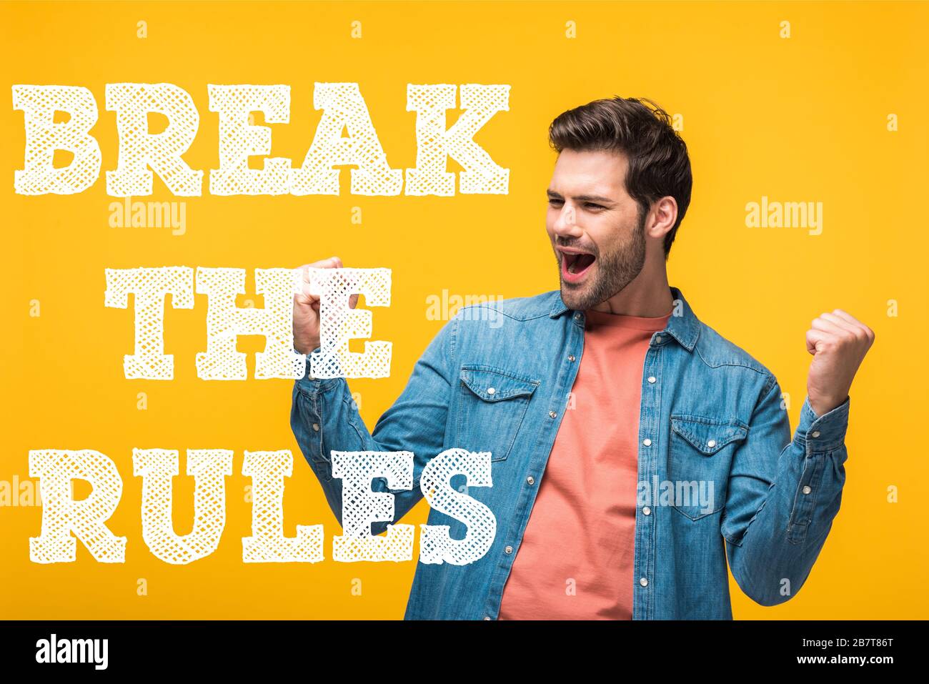 happy handsome man showing yes gesture isolated on yellow with break ...