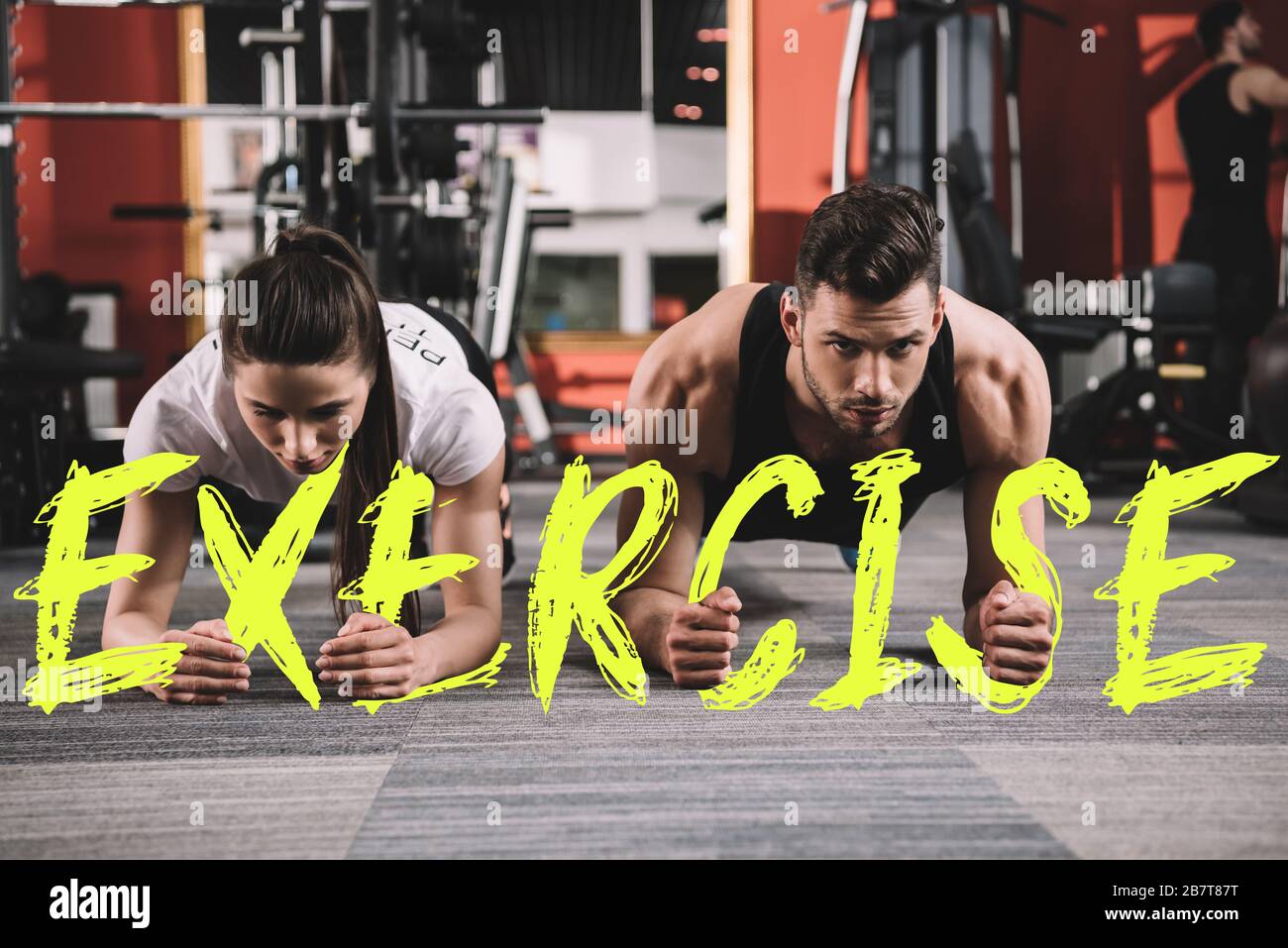 attractive trainer and handsome sportsman doing plank exercise near ...