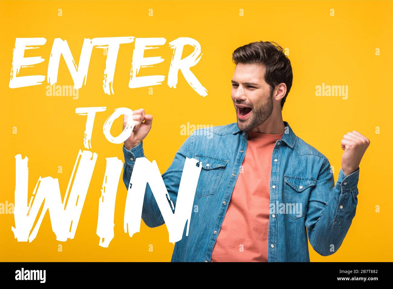 happy handsome man showing yes gesture isolated on yellow with enter to ...