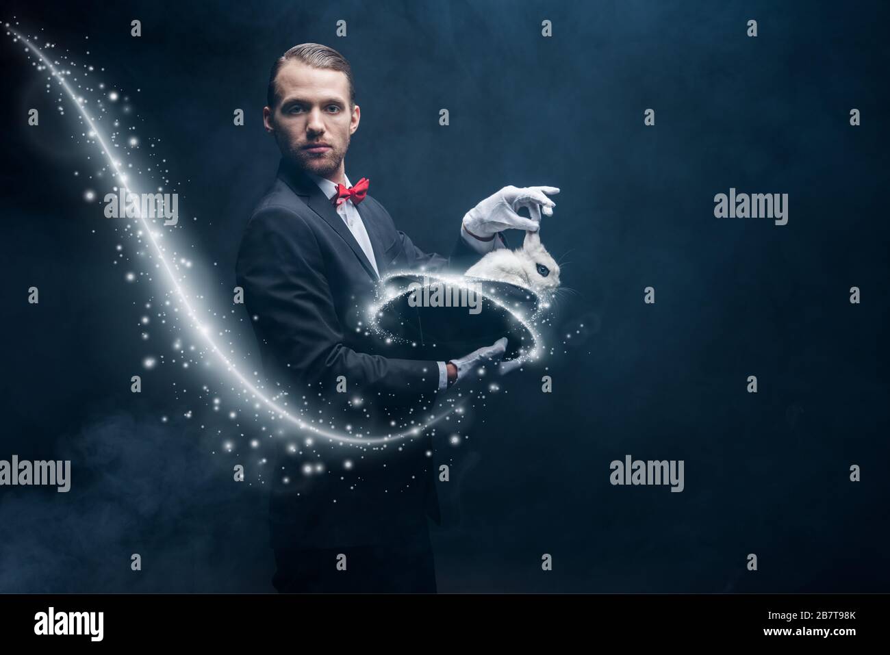 Professional magician in dark suit hi-res stock photography and images ...
